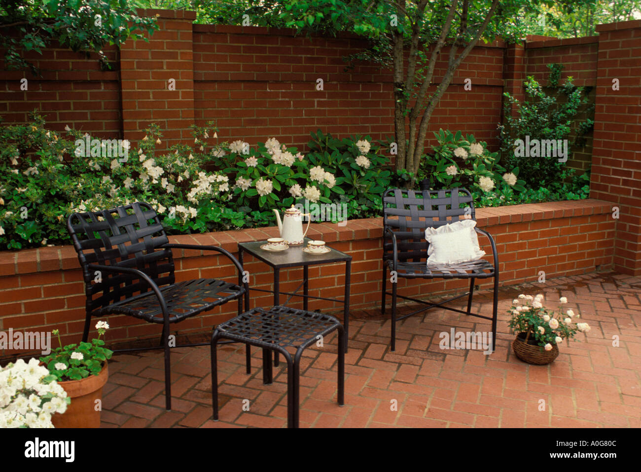 Tea time on the patio: Brick courtyard and patio with furniture and ...