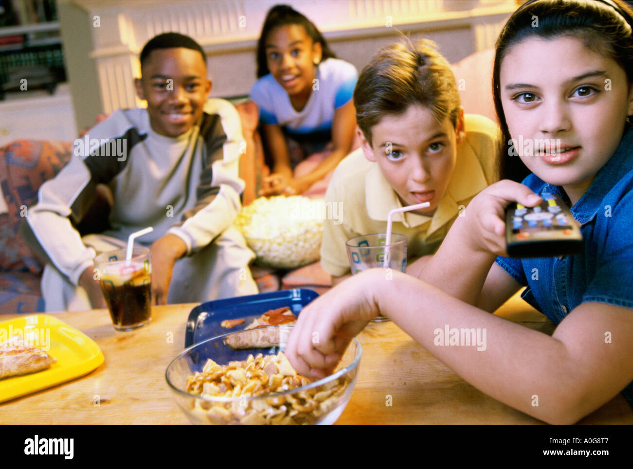Portrait of a group of children watching television Stock Photo - Alamy