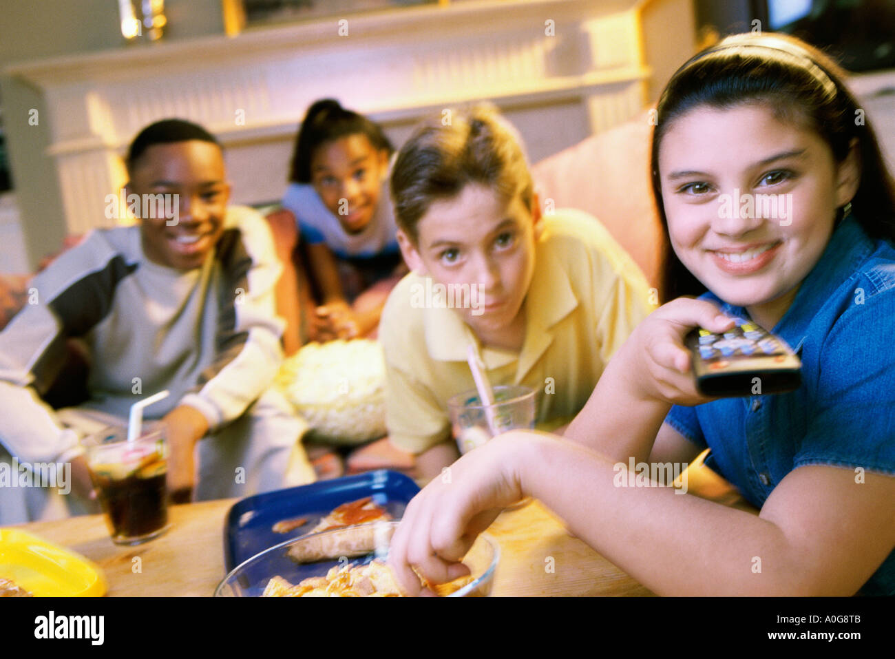 Portrait of a group of children watching television Stock Photo - Alamy