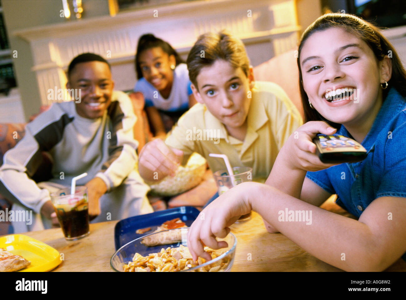 Portrait of a group of children watching television Stock Photo - Alamy