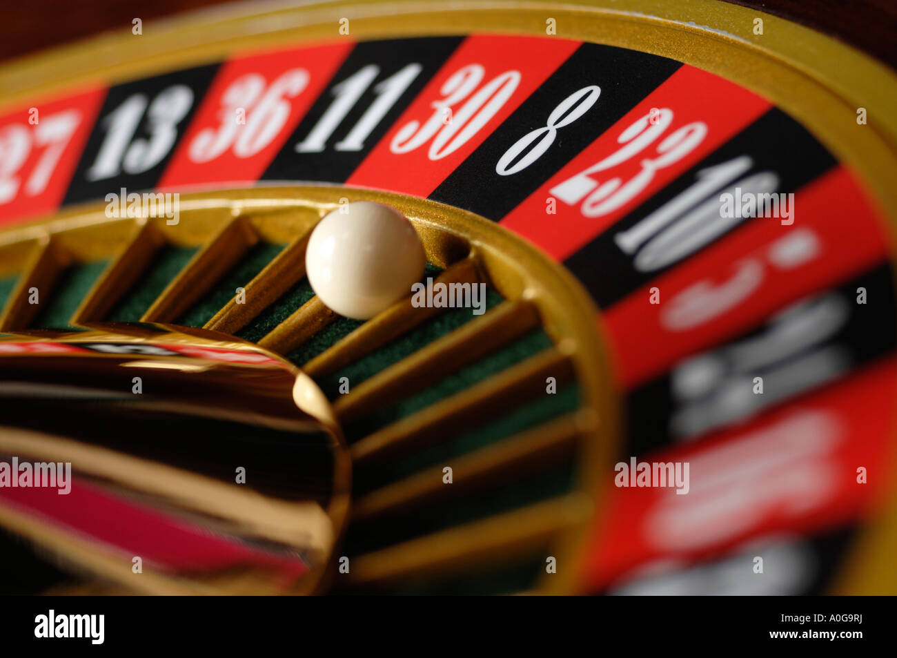 Roullette wheel with ball in number eight slot Stock Photo - Alamy