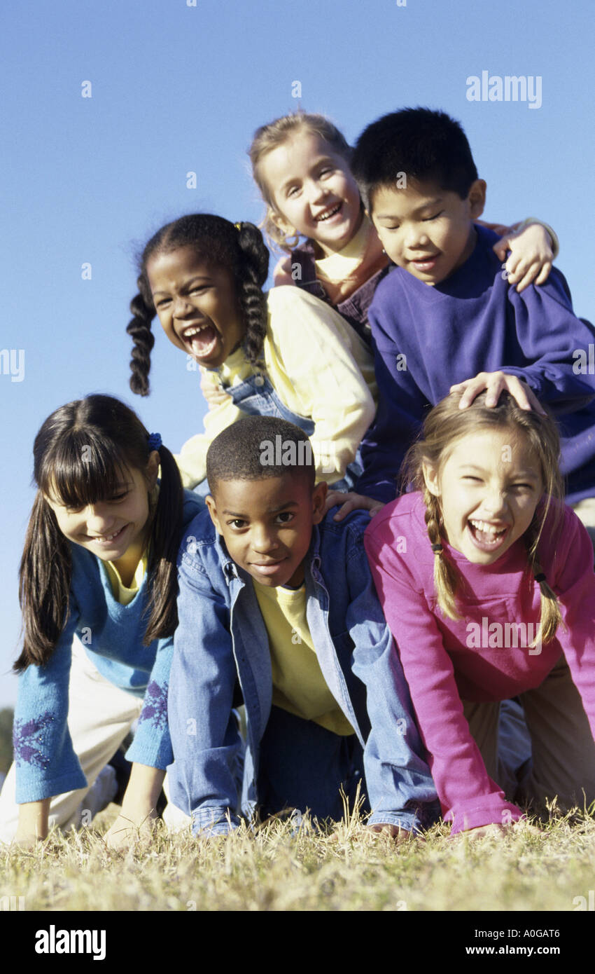 Portrait of a group of children making a human pyramid Stock Photo - Alamy