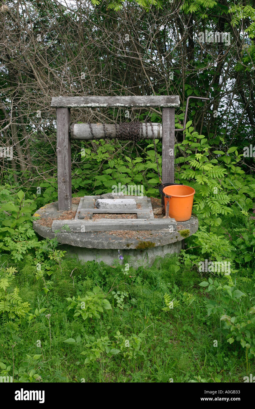 watering well with plastic bucket Stock Photo - Alamy