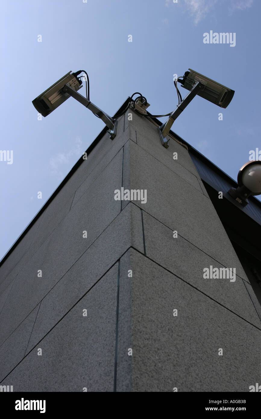 Surveillance camera on building exterior Stock Photo - Alamy