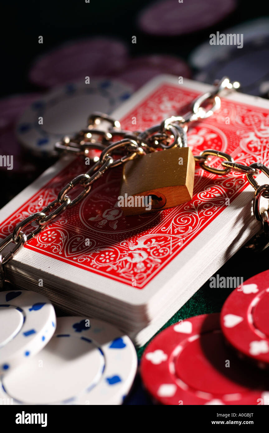 Deck of cards wrapped in chains on gambling chips Stock Photo - Alamy