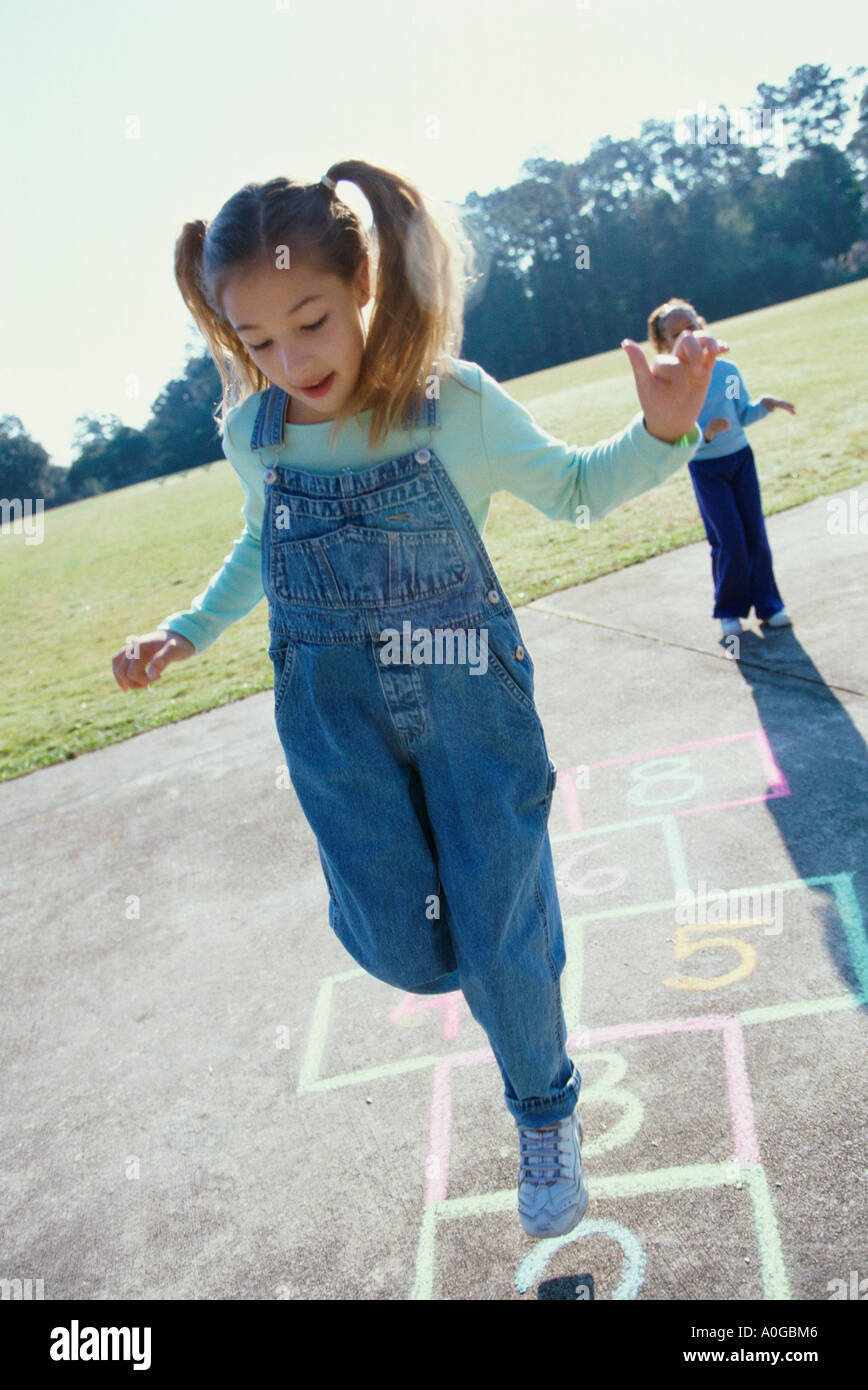 Girls playing hopscotch hi-res stock photography and images - Alamy
