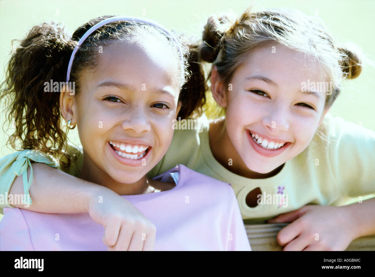 Portrait of two girls smiling Stock Photo - Alamy