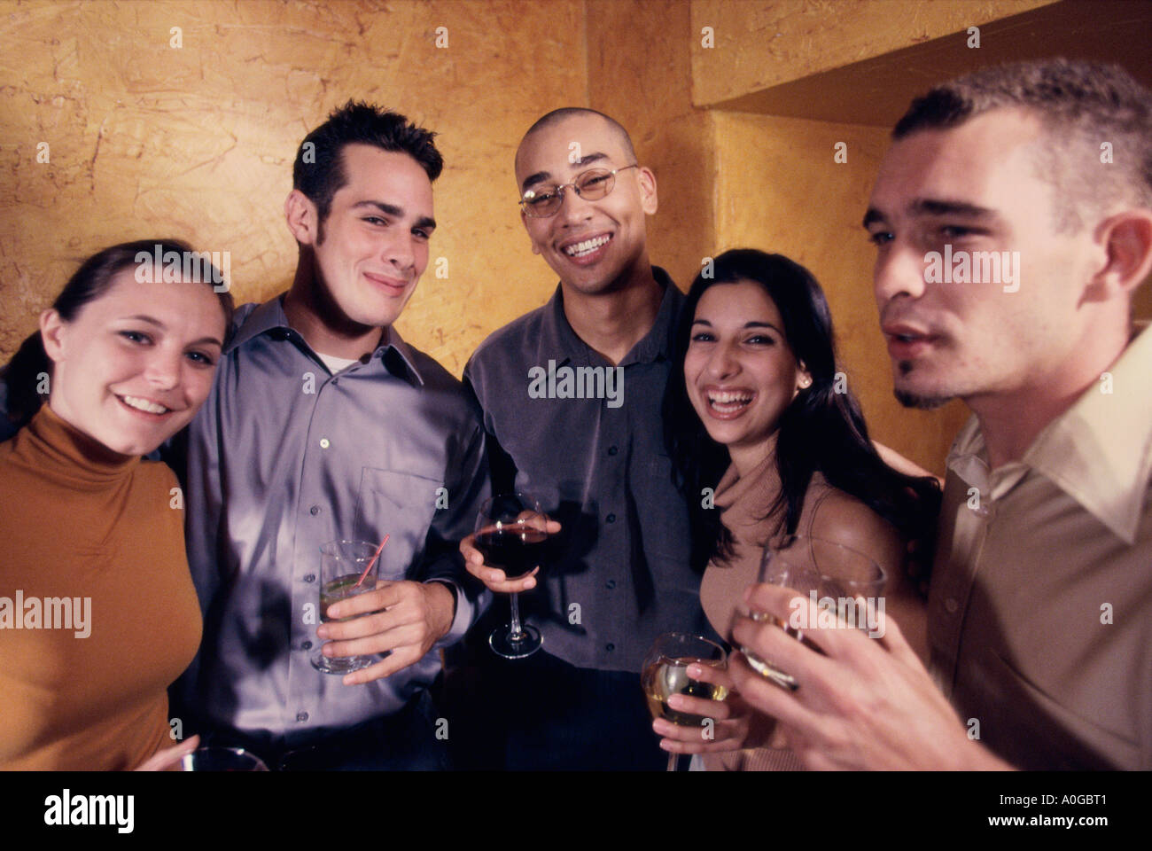 Portrait of a group of young people in a bar Stock Photo - Alamy