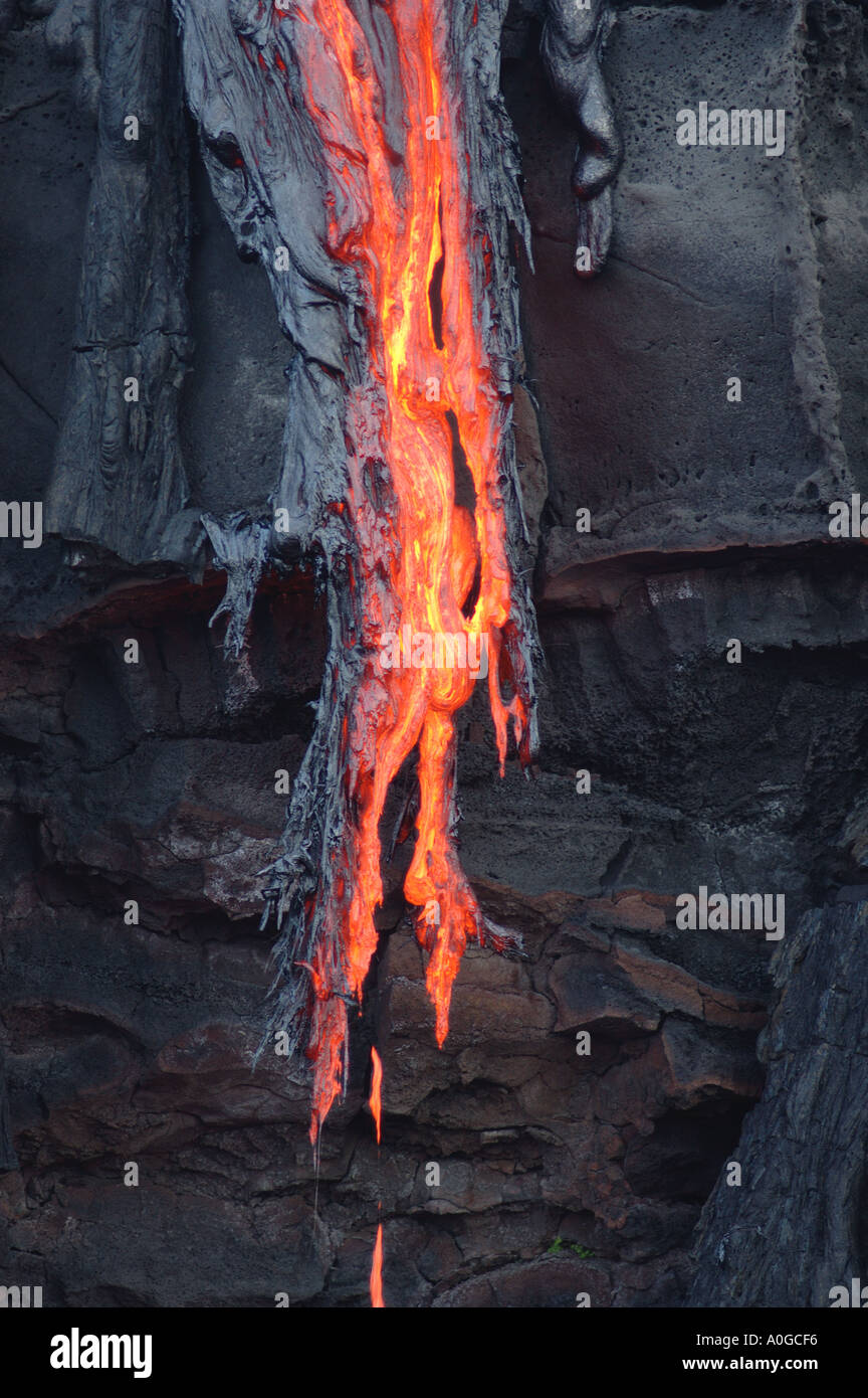 Lava falling over an old sea cliff Hawaii Volcanoes National Park Stock ...
