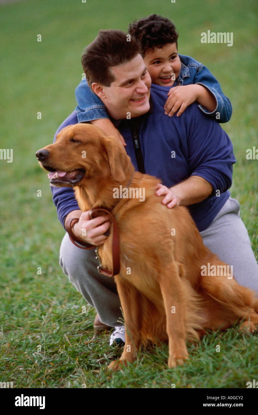 Father and his son with their dog Stock Photo - Alamy