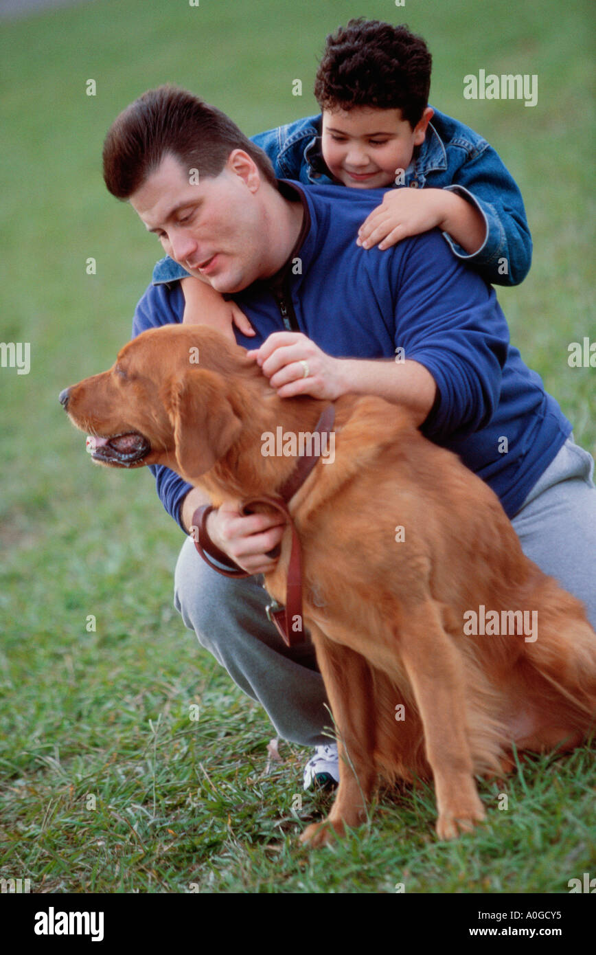 Father and his son with their dog Stock Photo - Alamy