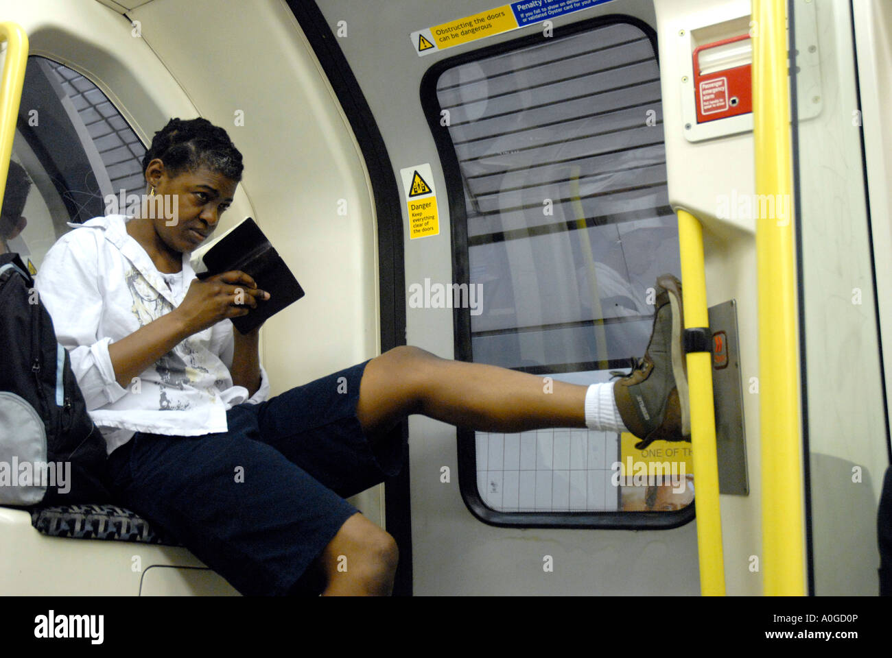 Passenger on a tube train London Stock Photo - Alamy