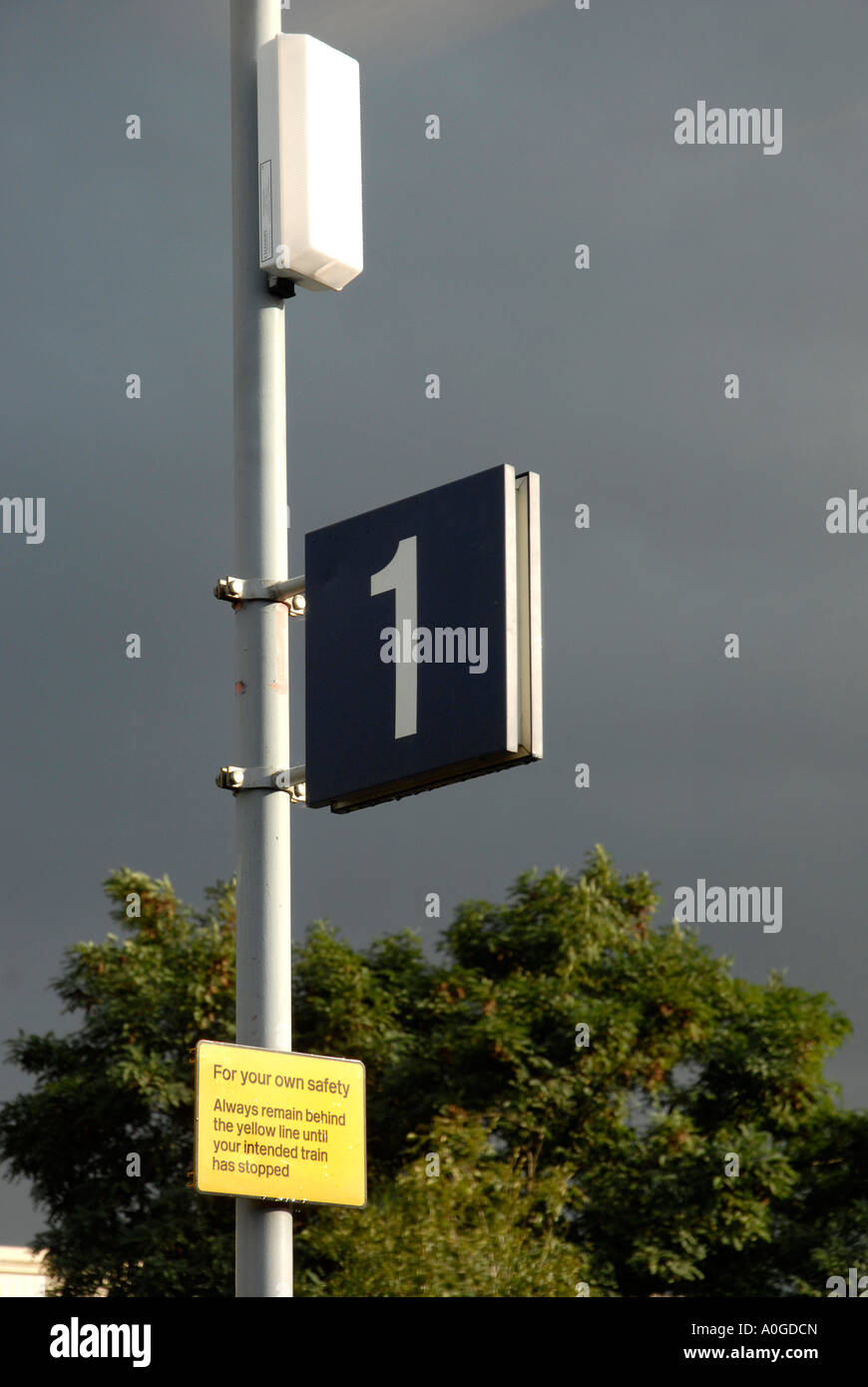 Platform 1 and safety sign at railway station London Stock Photo - Alamy