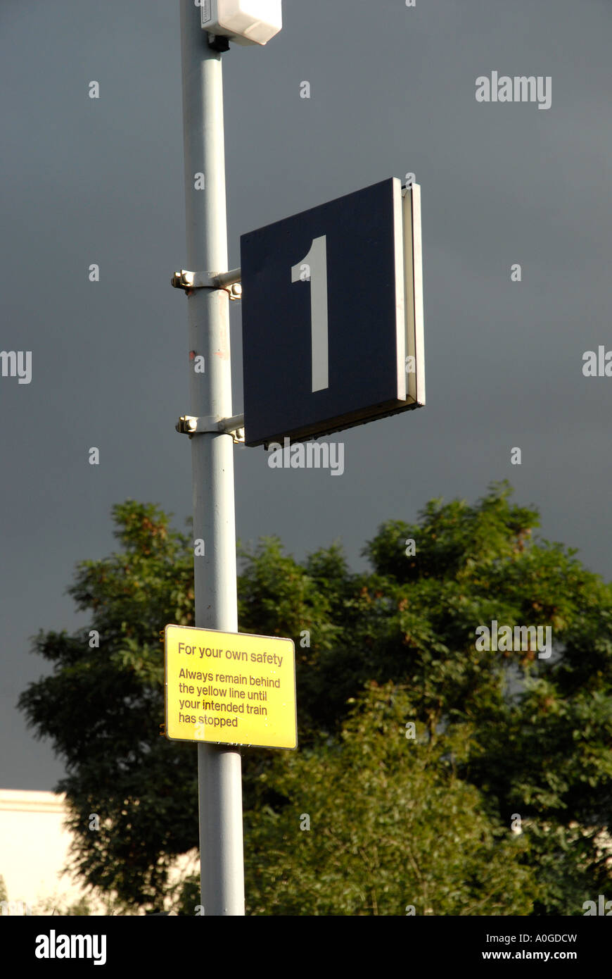 Platform 1 and safety sign at railway station London Stock Photo - Alamy