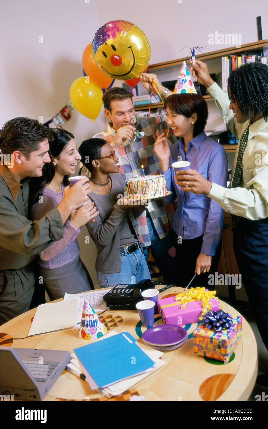 Group of business executives celebrating a birthday in the office Stock ...