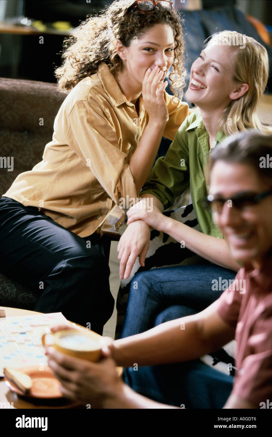 Three women sitting in a cafeteria hi-res stock photography and images ...