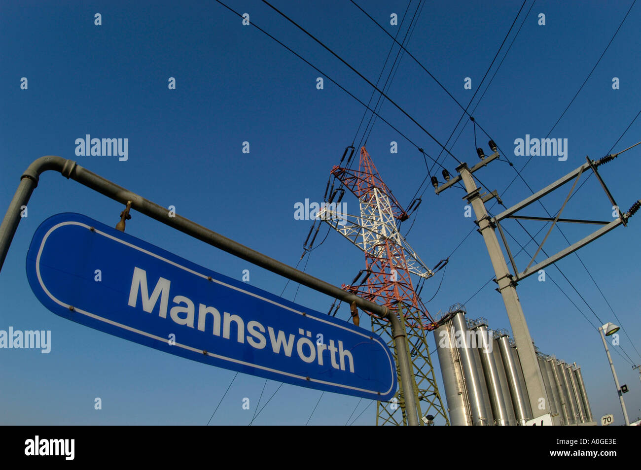 high voltage mast, cables, sign Mannswoerth Stock Photo - Alamy
