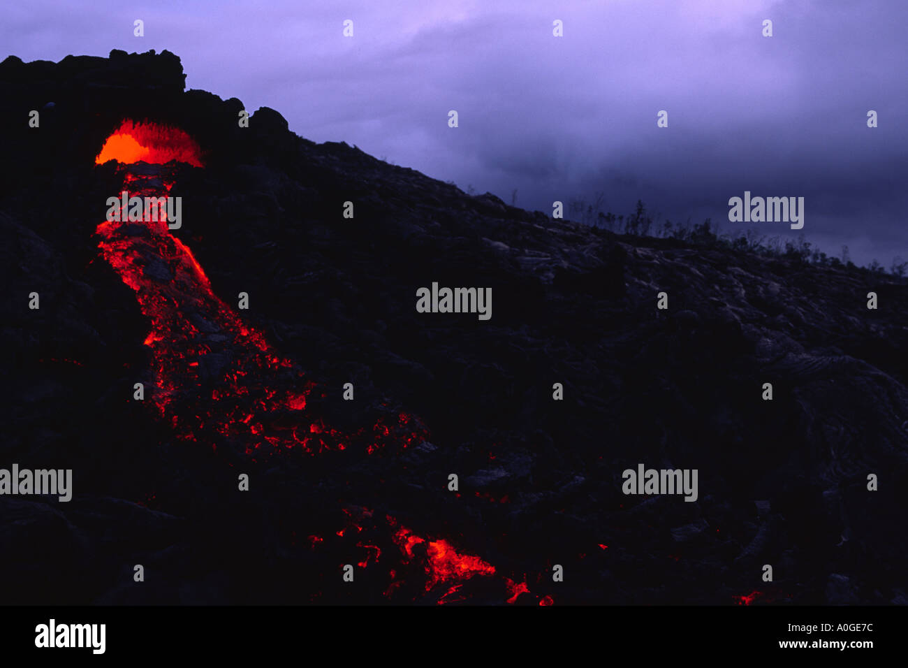 Large tube breakout sends a stream of lava into the early morning light ...
