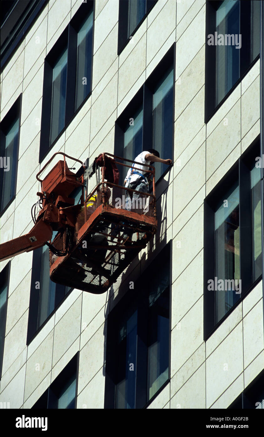 Fitting Glass Pane into New Building Manchester UK Stock Photo - Alamy