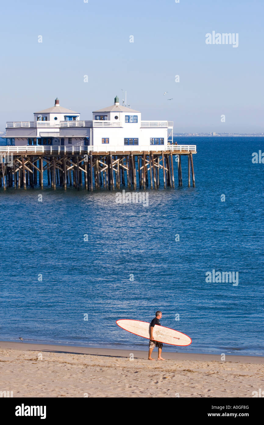 Surfer in front of Pier at SurfRider beach, Malibu Stock Photo - Alamy