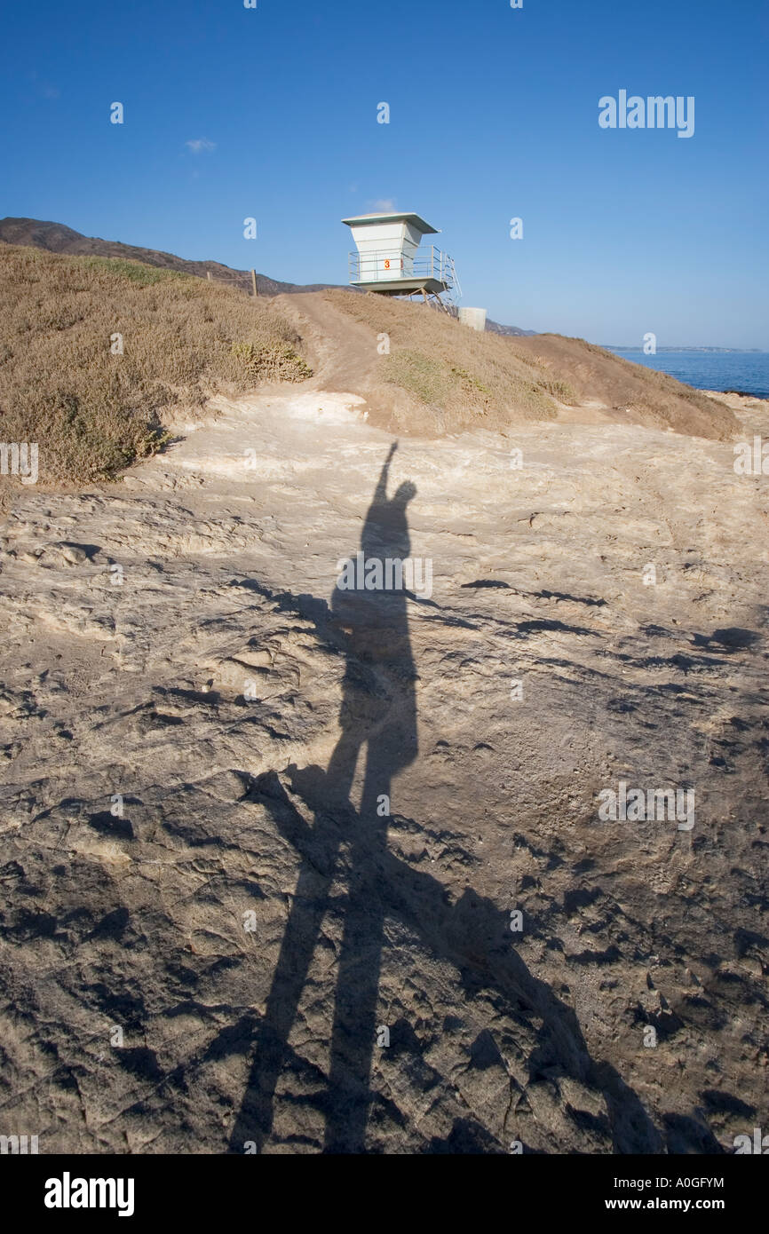 Man’s Shadow In Front of a Lifeguard Tower Stock Photo - Alamy