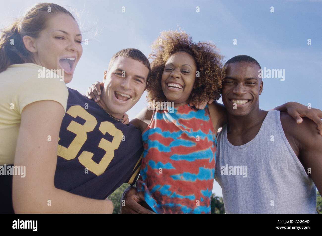 Portrait of two young couples smiling together Stock Photo - Alamy