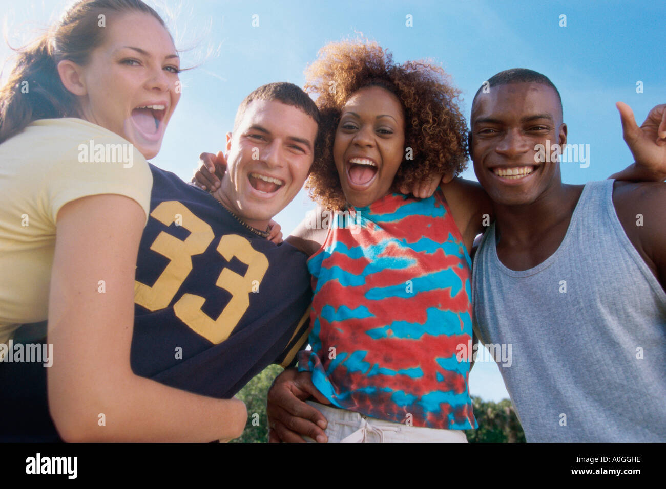 Portrait of two young couples smiling together Stock Photo - Alamy