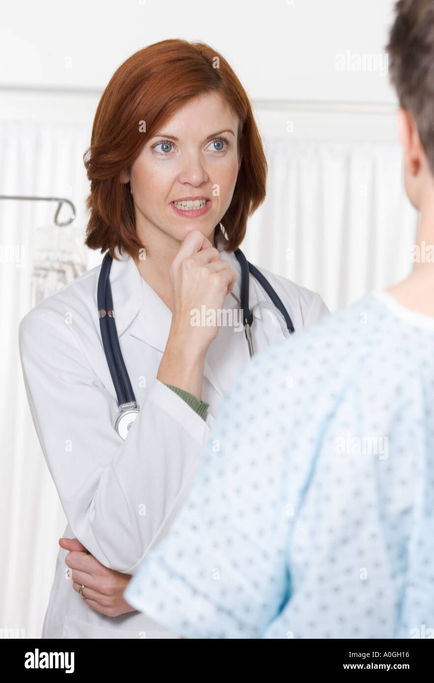 Female doctor talking with patient Stock Photo - Alamy