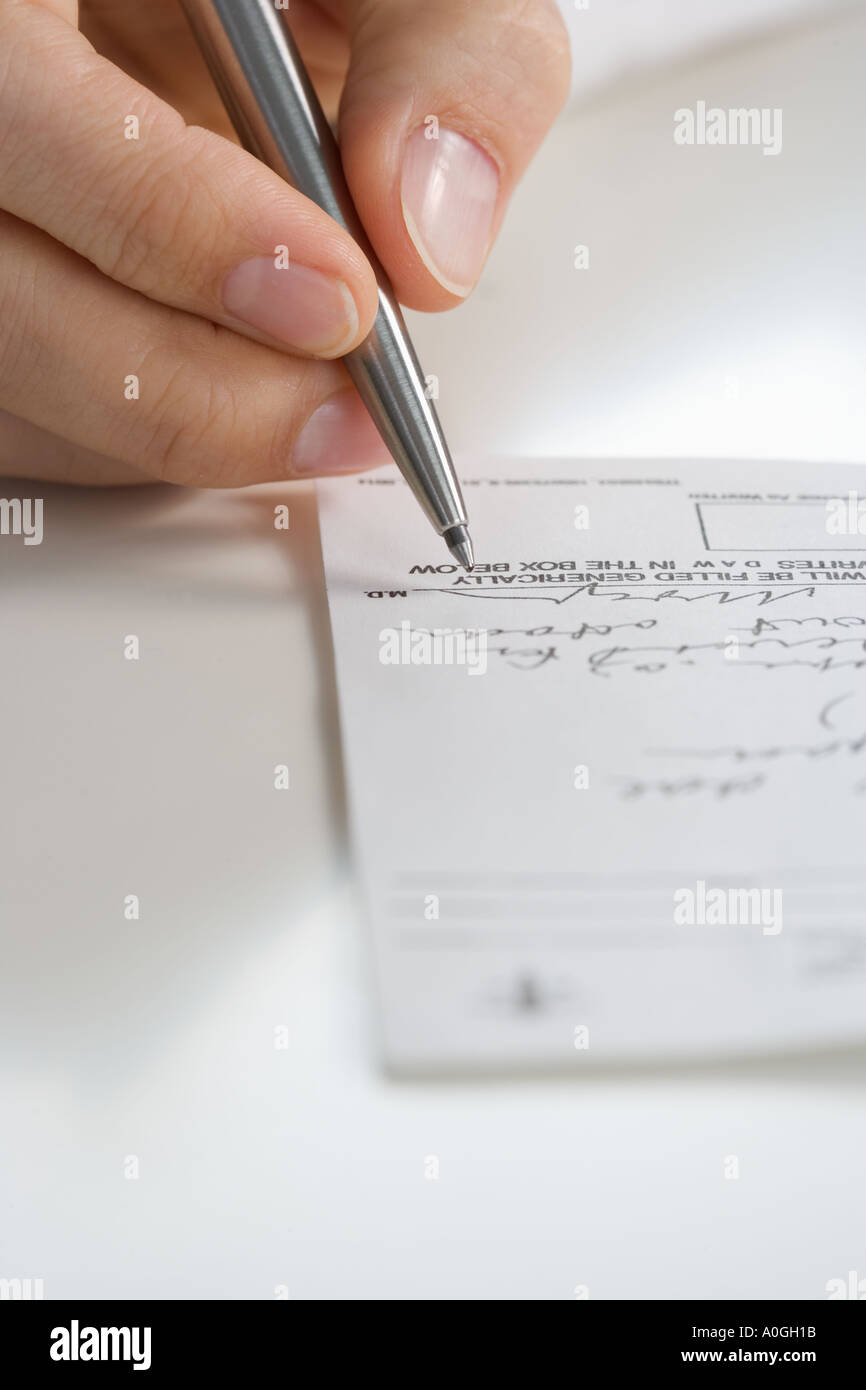 Closeup of hand writing prescription Stock Photo - Alamy