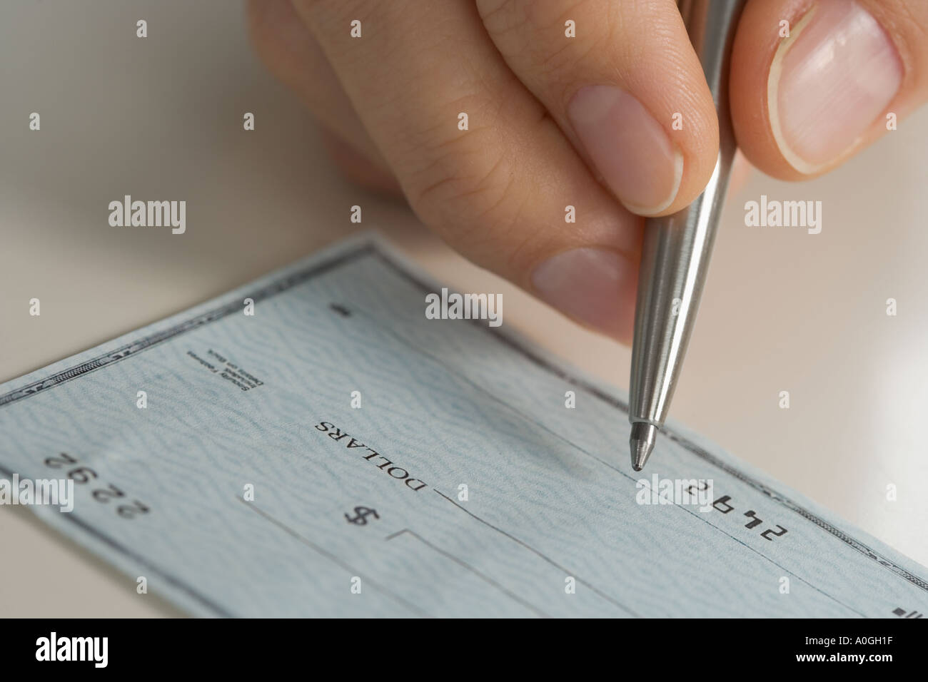 Hand writing cheque hi-res stock photography and images - Alamy