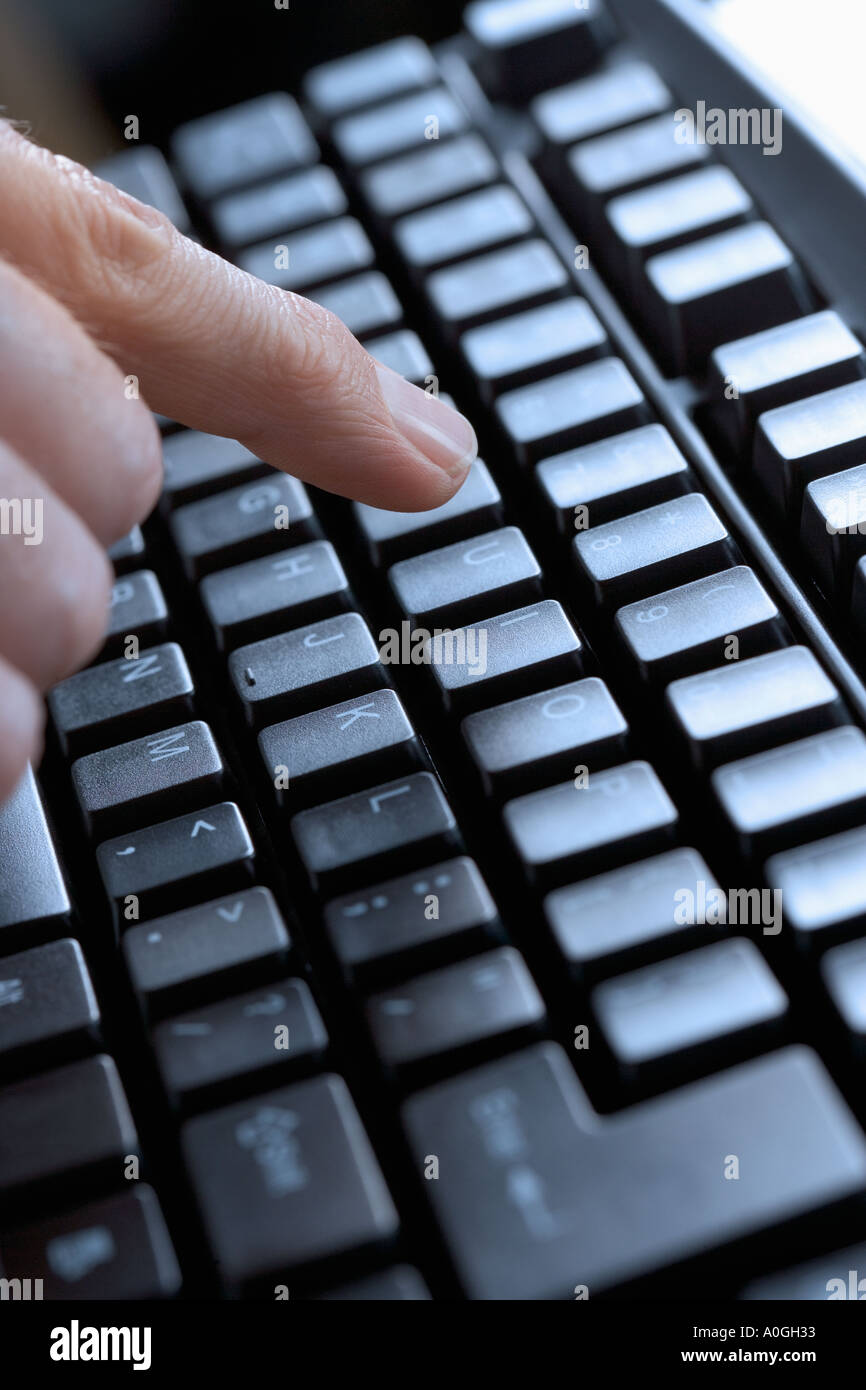 Closeup of finger and computer keyboard Stock Photo - Alamy