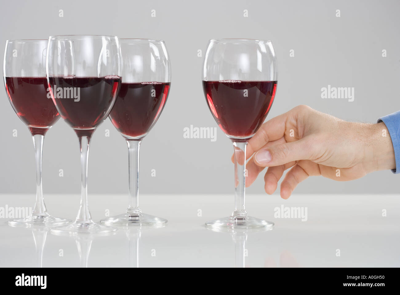 Hand reaching glass alcoholic drink hi-res stock photography and images ...