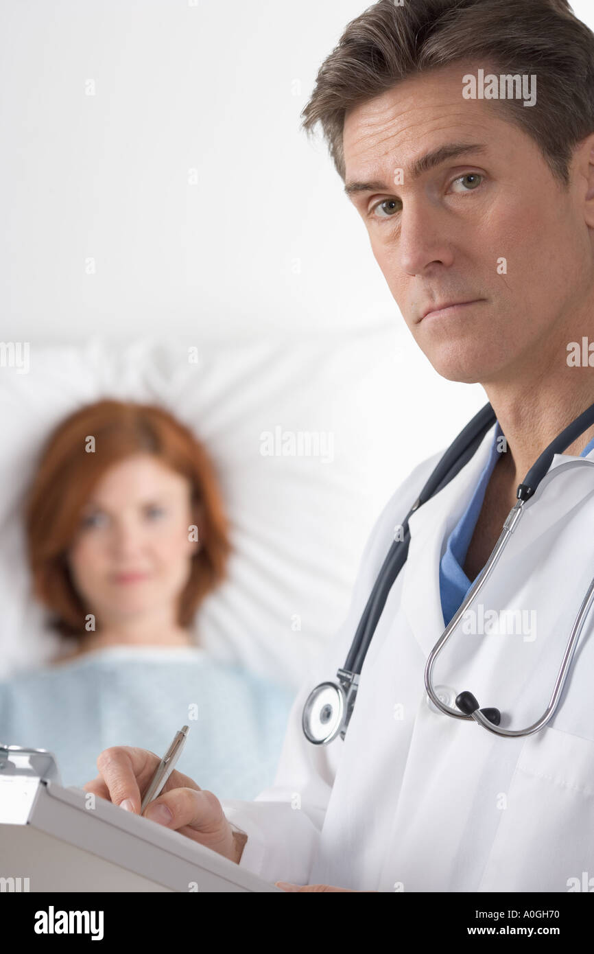 Doctor visiting with patient Stock Photo - Alamy