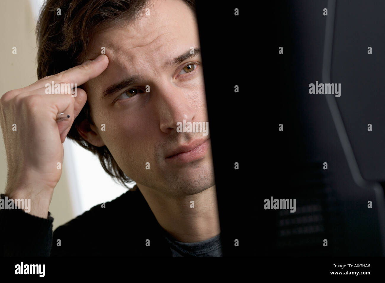 Closeup of man concentrating at computer Stock Photo - Alamy