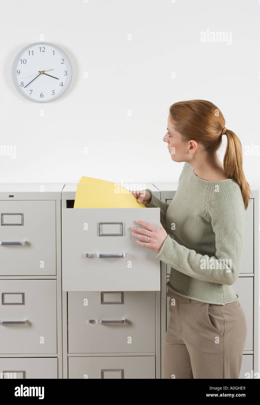 Clock watching woman office hi-res stock photography and images - Alamy