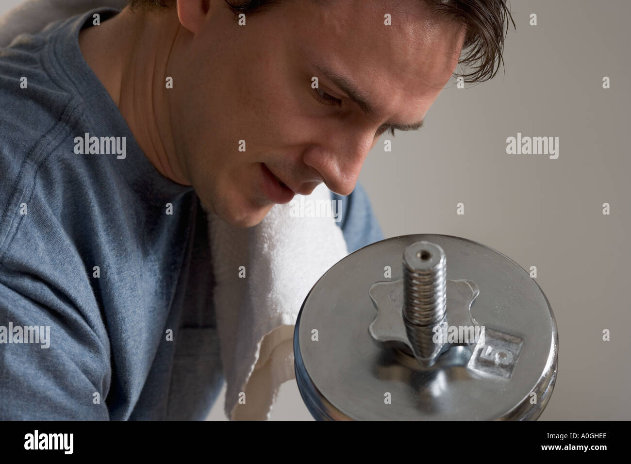Focused man lifting heavy weights hi-res stock photography and images ...
