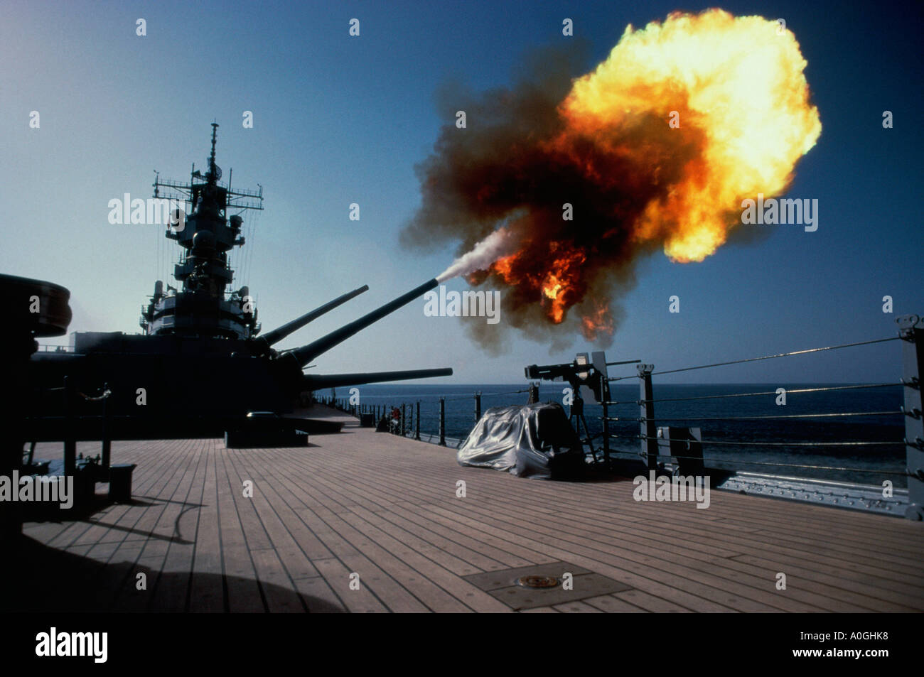 USS Wisconsin firing Mark 7 guns Stock Photo - Alamy