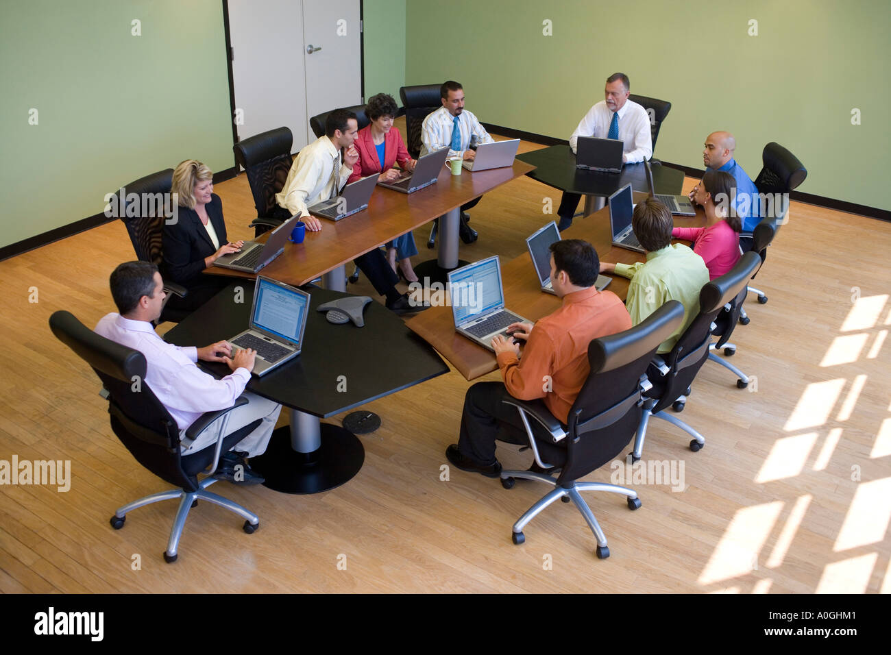 High angle view of business executives sitting in a conference room ...