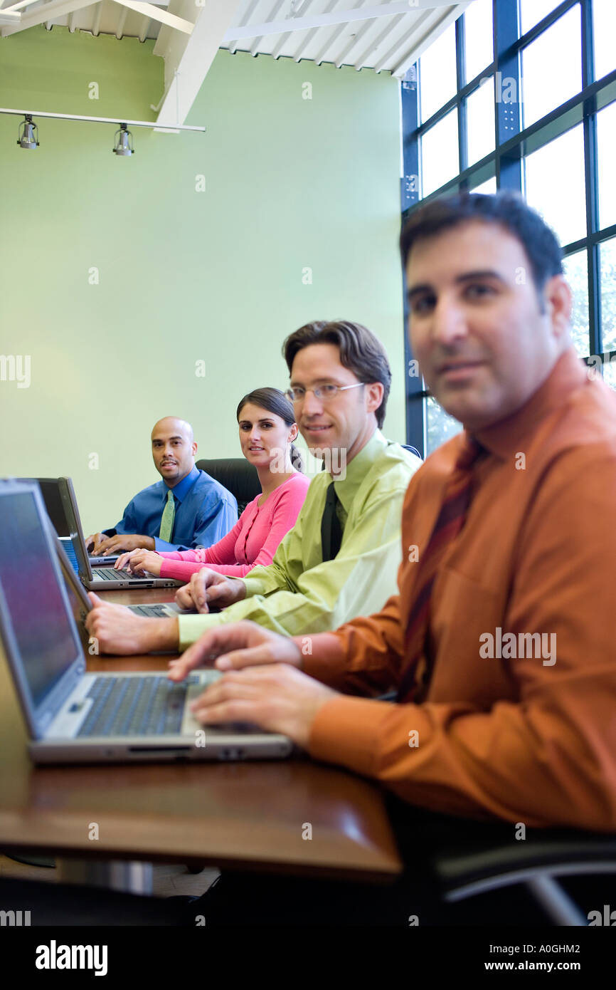 Business executives sitting in a conference room Stock Photo - Alamy