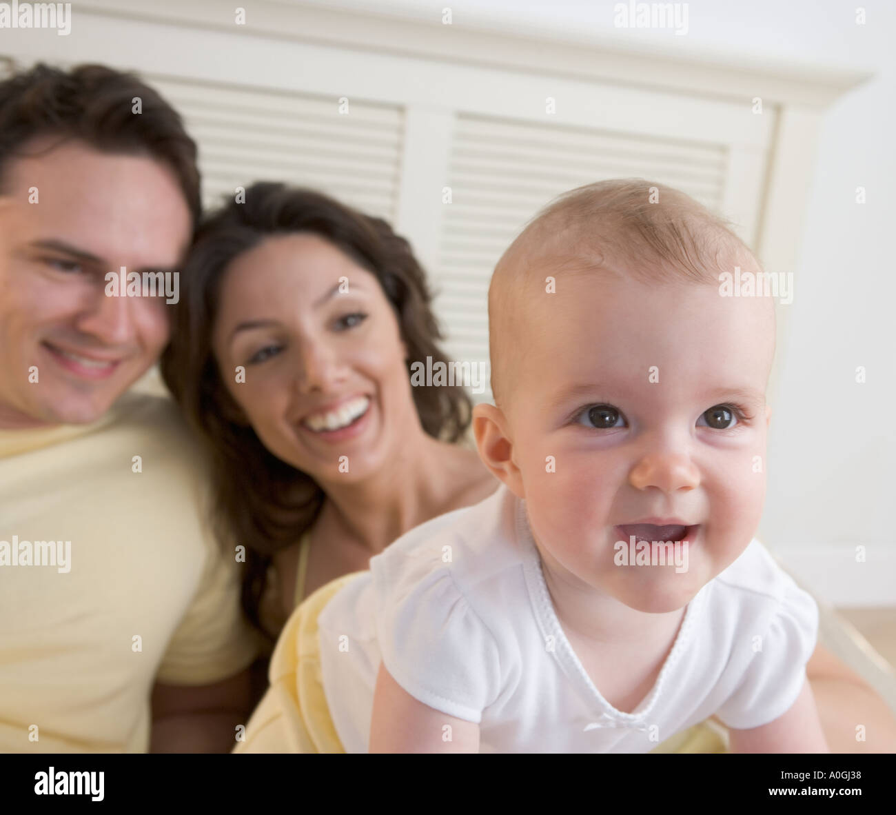 Happy parents watching baby play hi-res stock photography and images ...