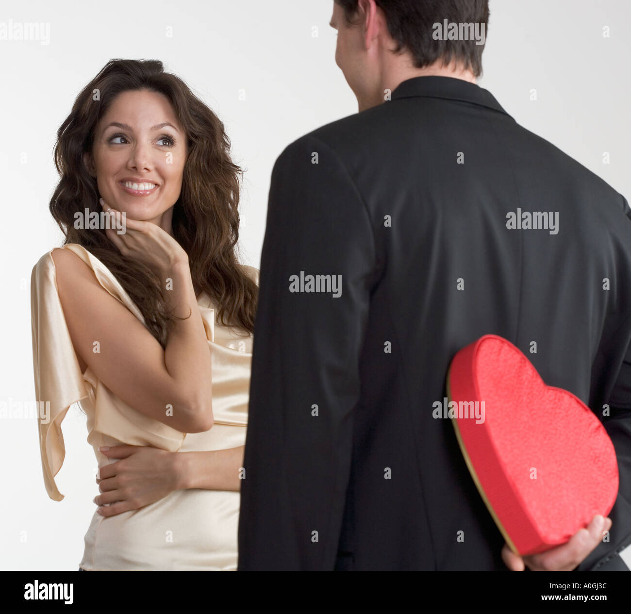 Man surprising woman with valentine Stock Photo - Alamy