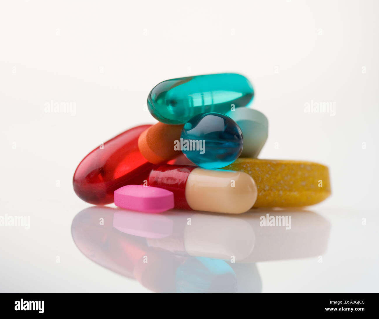 Closeup of pile of multi colored pills Stock Photo - Alamy