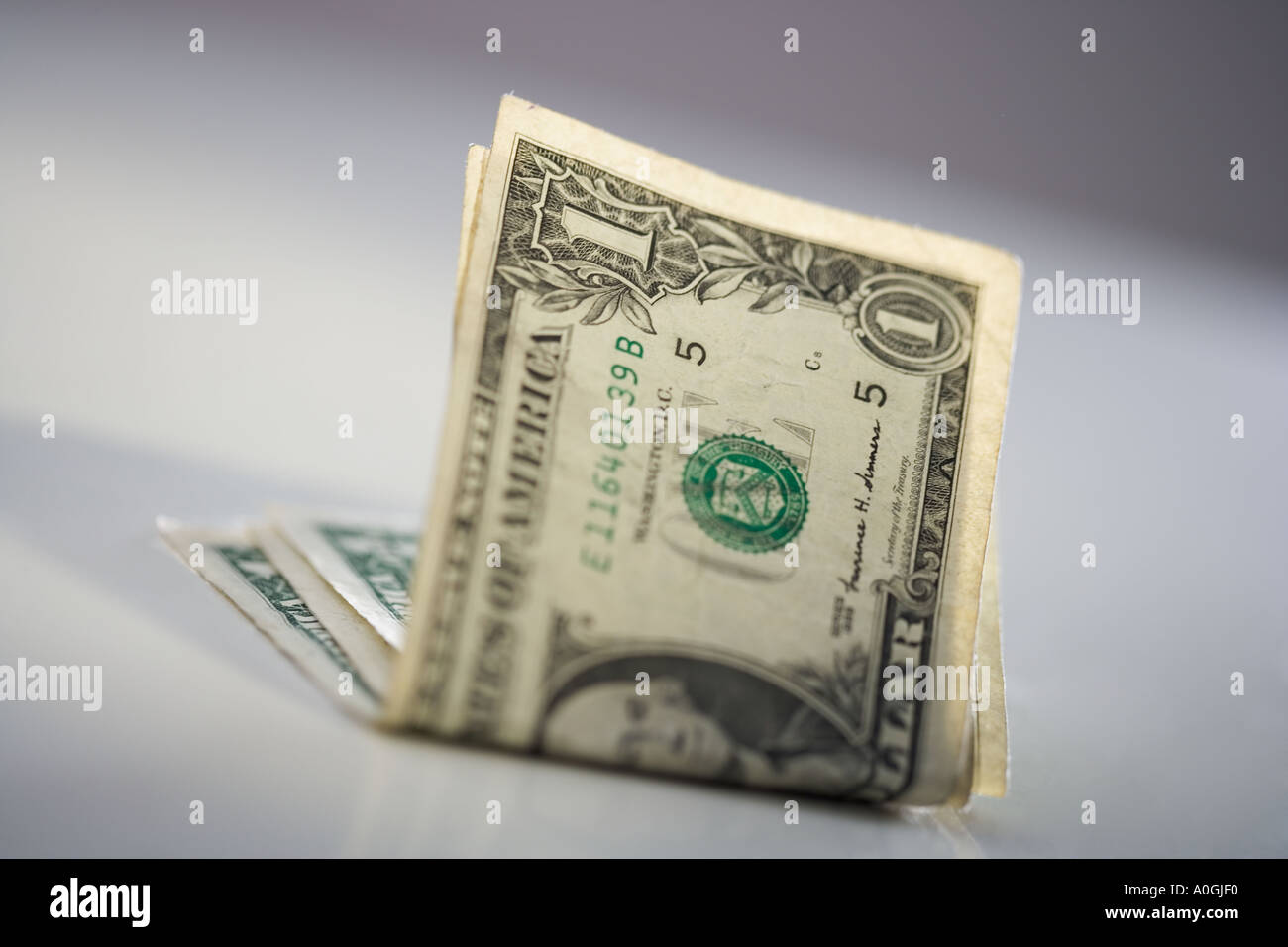 Folded one dollar bills Stock Photo - Alamy