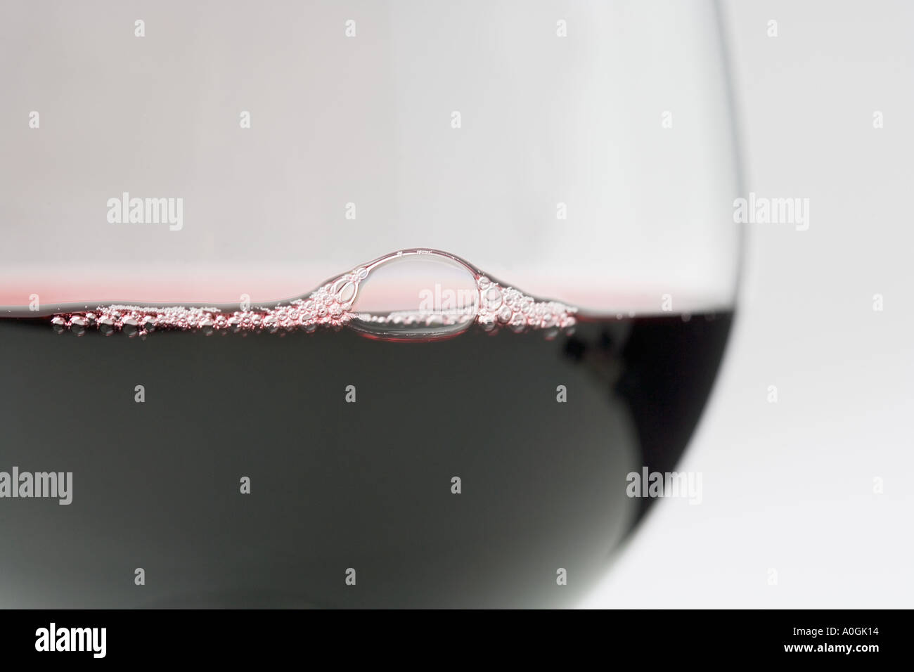 Closeup of bubbles in red wine Stock Photo - Alamy
