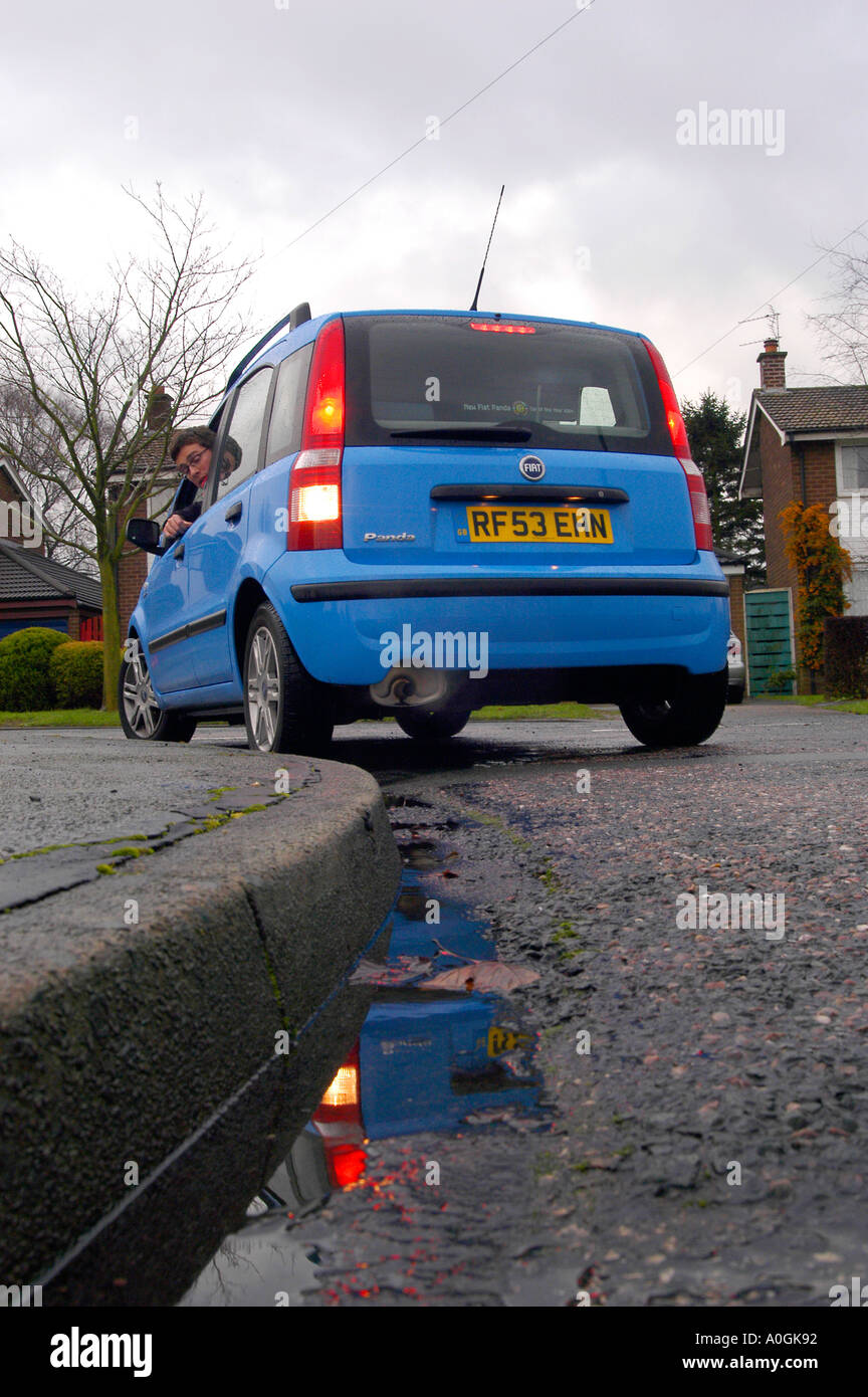 Learner driver reversing around a corner Stock Photo - Alamy