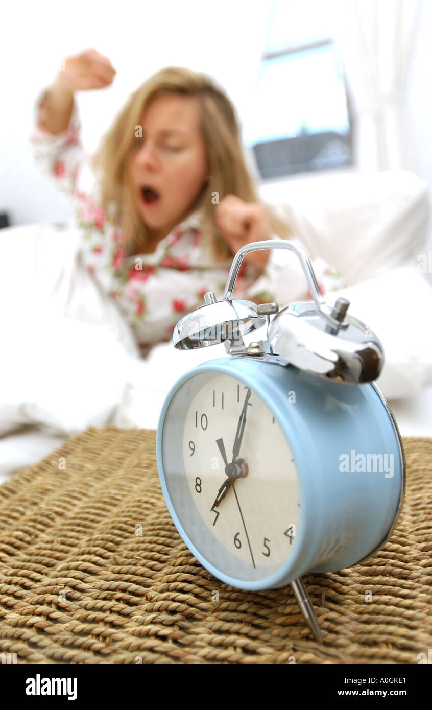 woman awake to alarm clock Stock Photo - Alamy