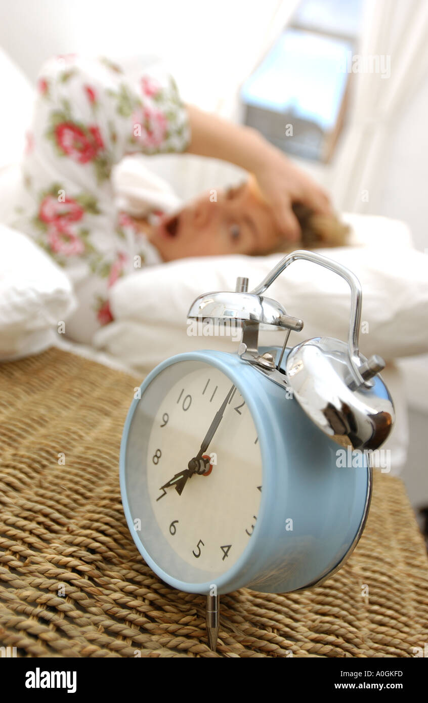 woman awake to alarm clock Stock Photo - Alamy