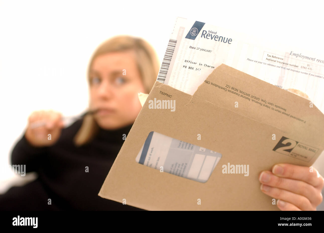 Woman with tax returns Stock Photo - Alamy
