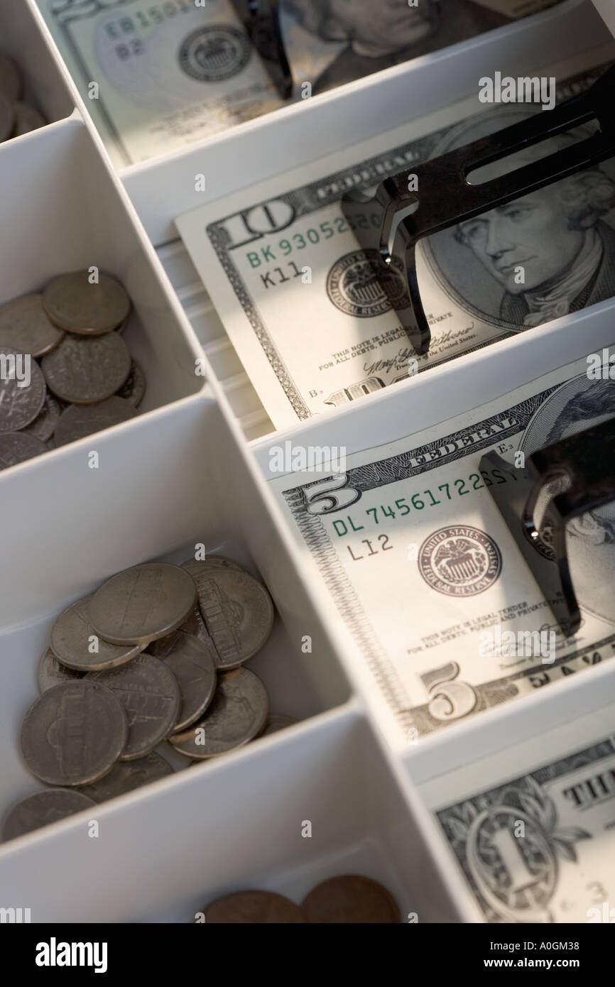 U S bills and coins in cash register Stock Photo - Alamy