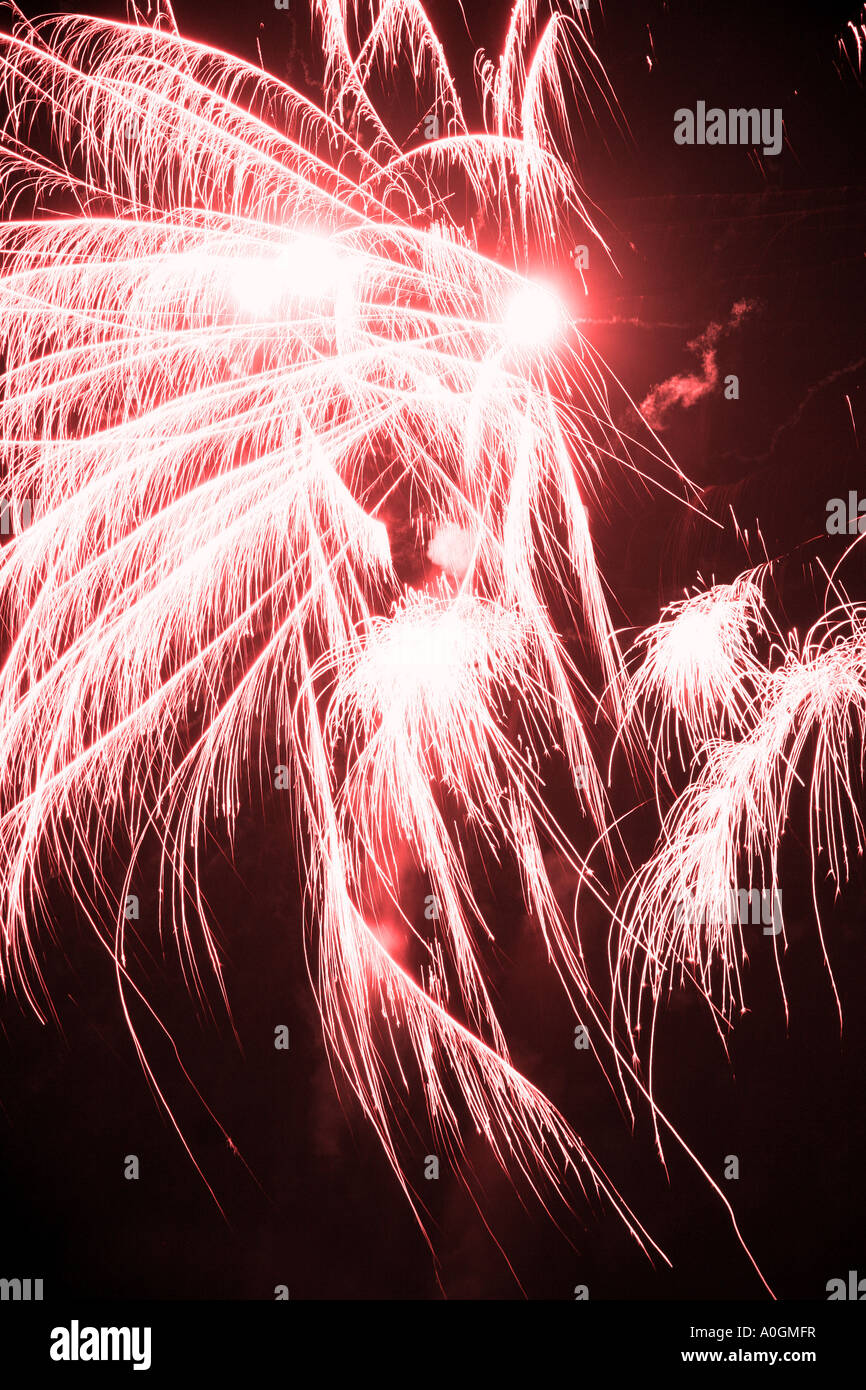 pink sparkes from a rocket on fireworks night Stock Photo - Alamy